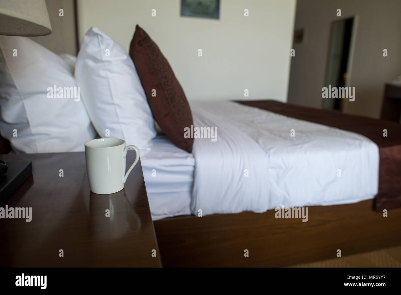 cup of coffee on nightstand in hotel room Stock Photo - Alamy