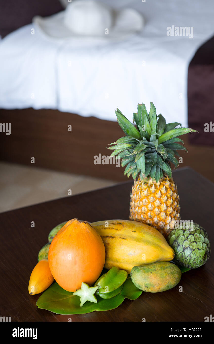 delicious tropical fruits composition on table at hotel room Stock ...