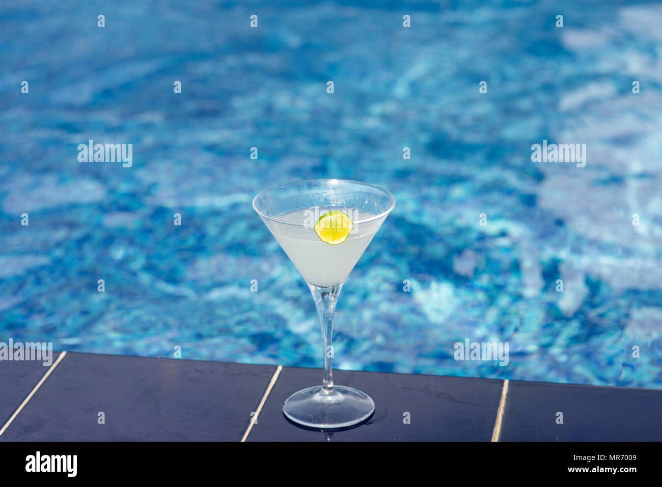 tasty margarita cocktail standing by swimming pool Stock Photo - Alamy