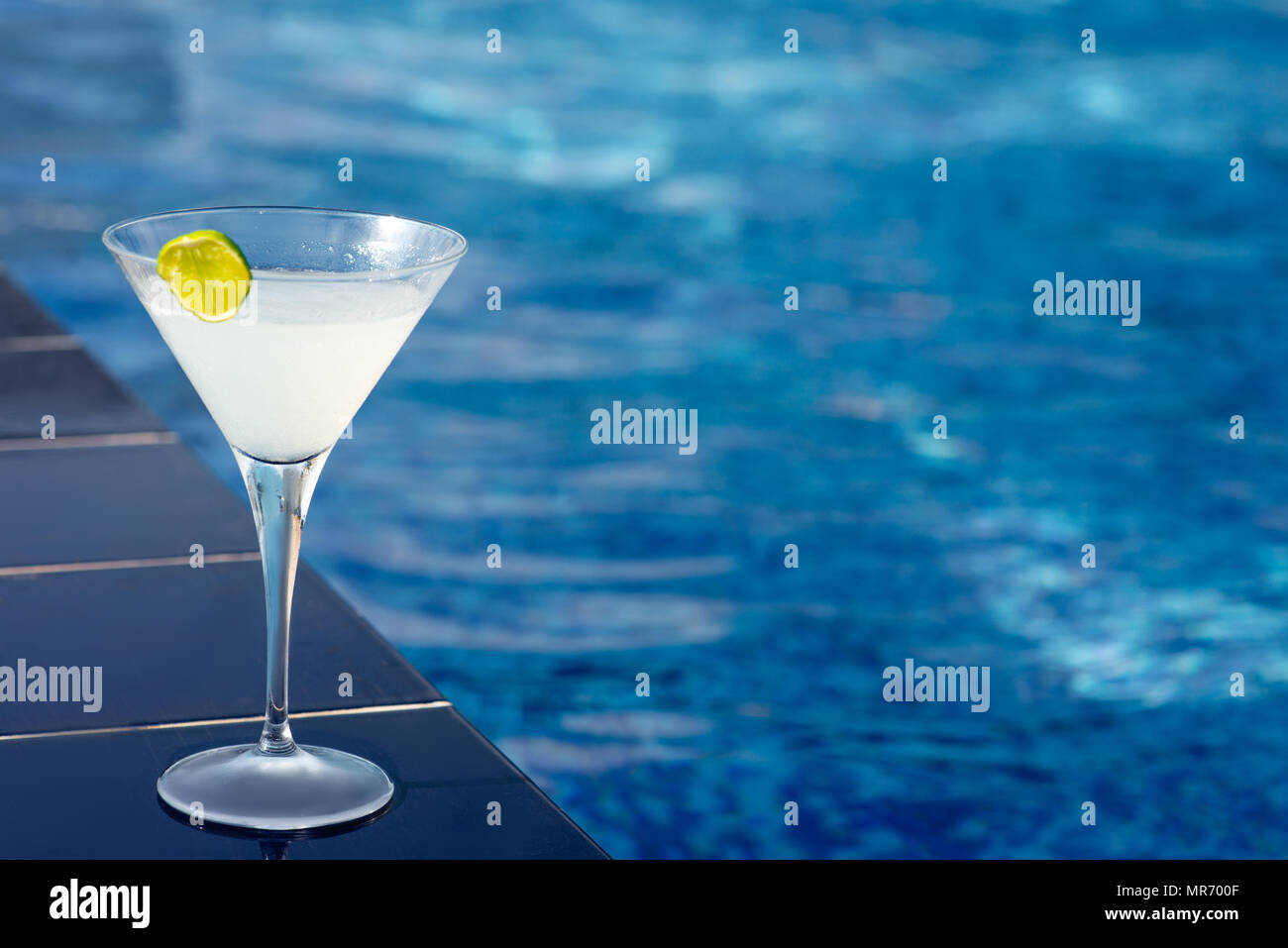 margarita cocktail standing by swimming pool Stock Photo - Alamy