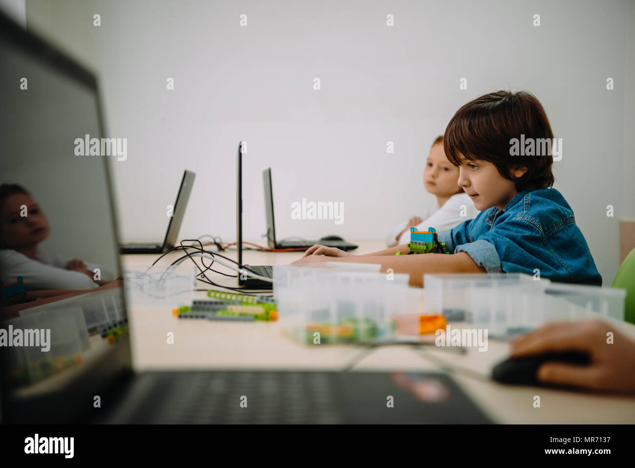 concetrated kids working with computers on stem education class Stock ...