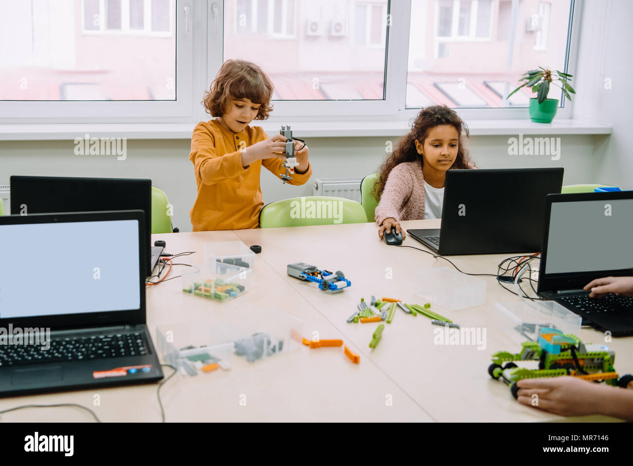 group of kids learning together, stem education concept Stock Photo - Alamy