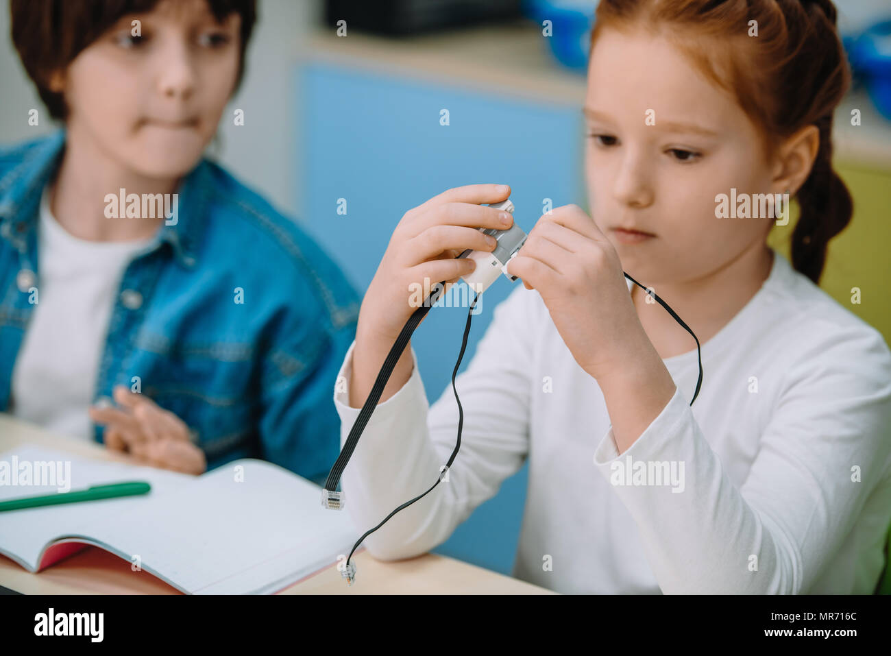 schoolchildren constructing project together, stem education concept ...