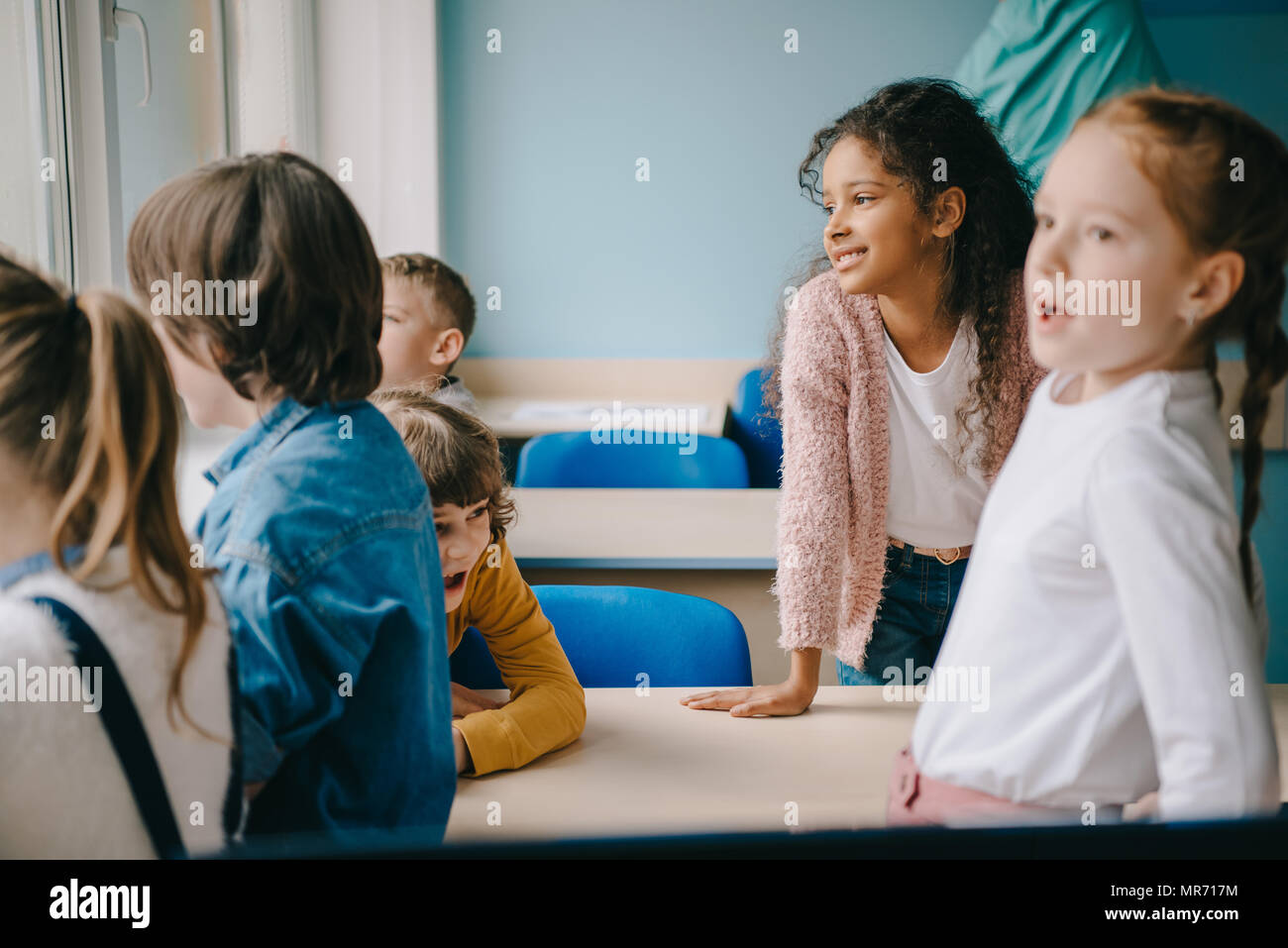 group of kids spending time together at classroom Stock Photo - Alamy