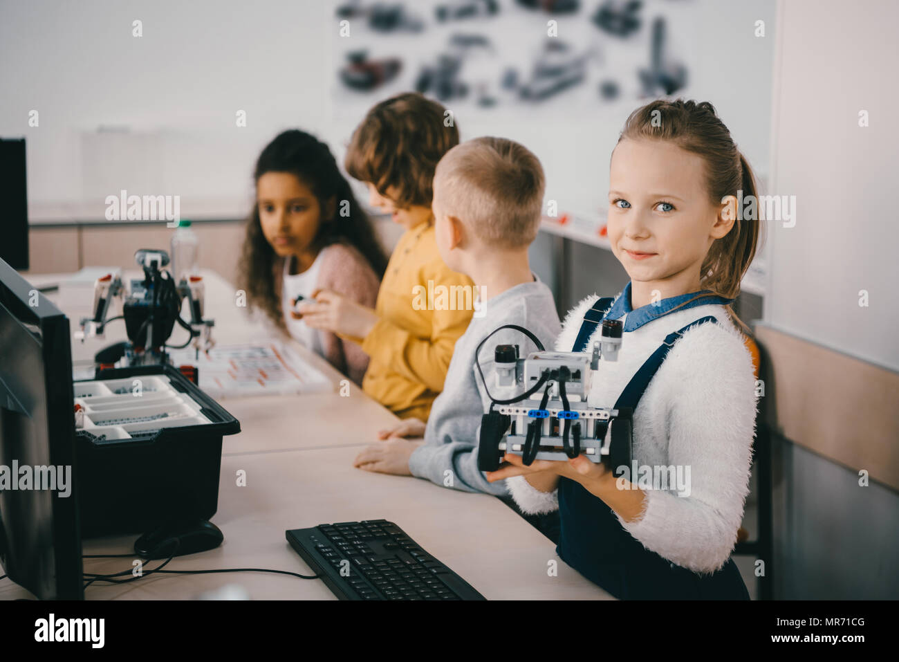 little kids with robots at stem educaion class Stock Photo - Alamy