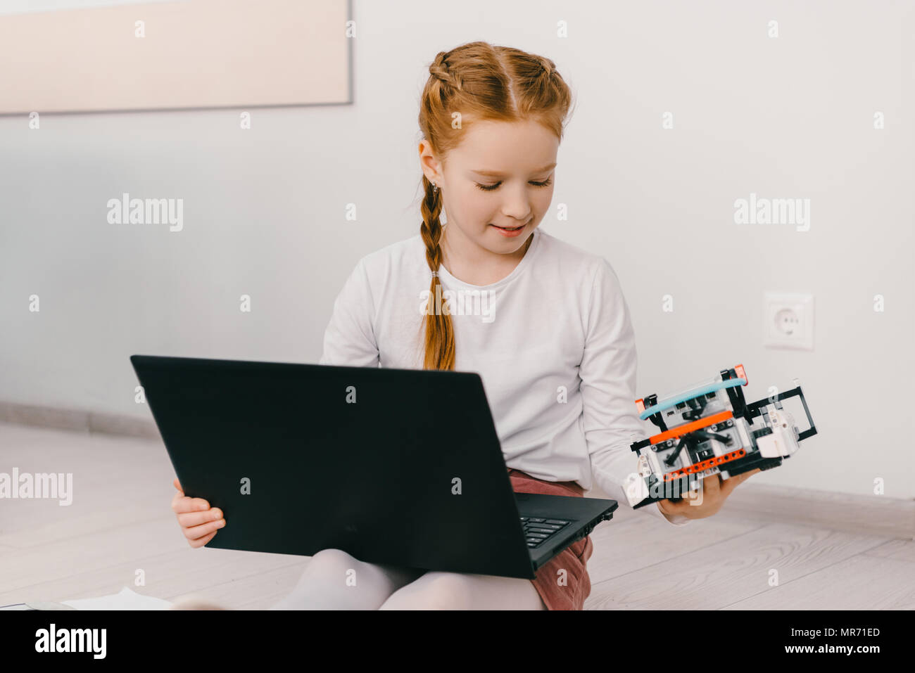 concentrated little child programming diy robot, stem education concept ...