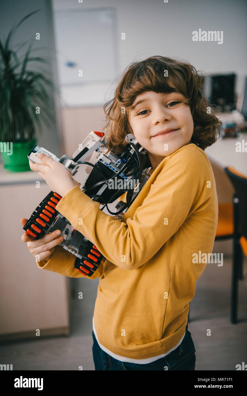 happy little kid embracing with diy robot Stock Photo - Alamy