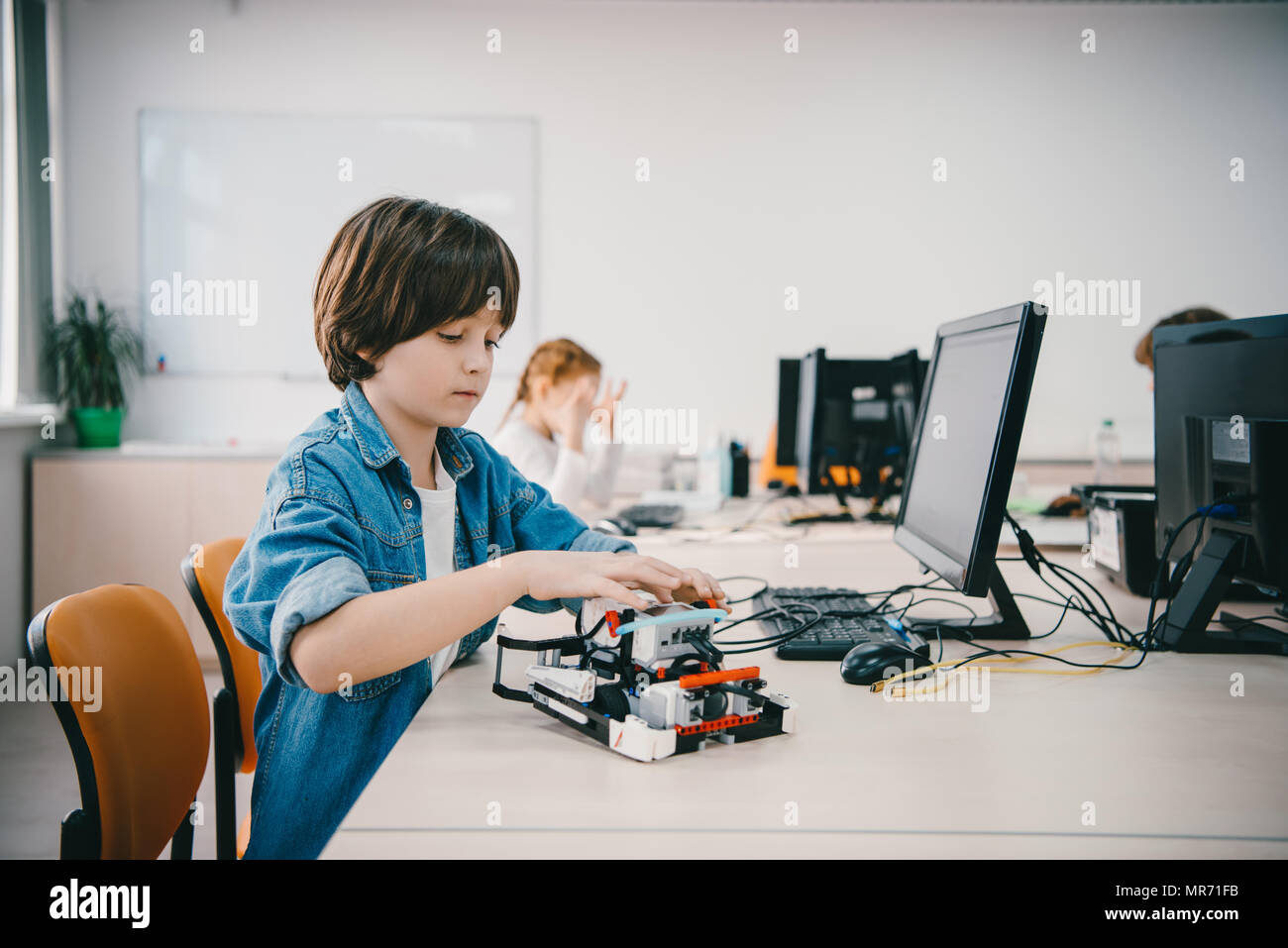 teen kid programming diy robot at machinery class Stock Photo - Alamy