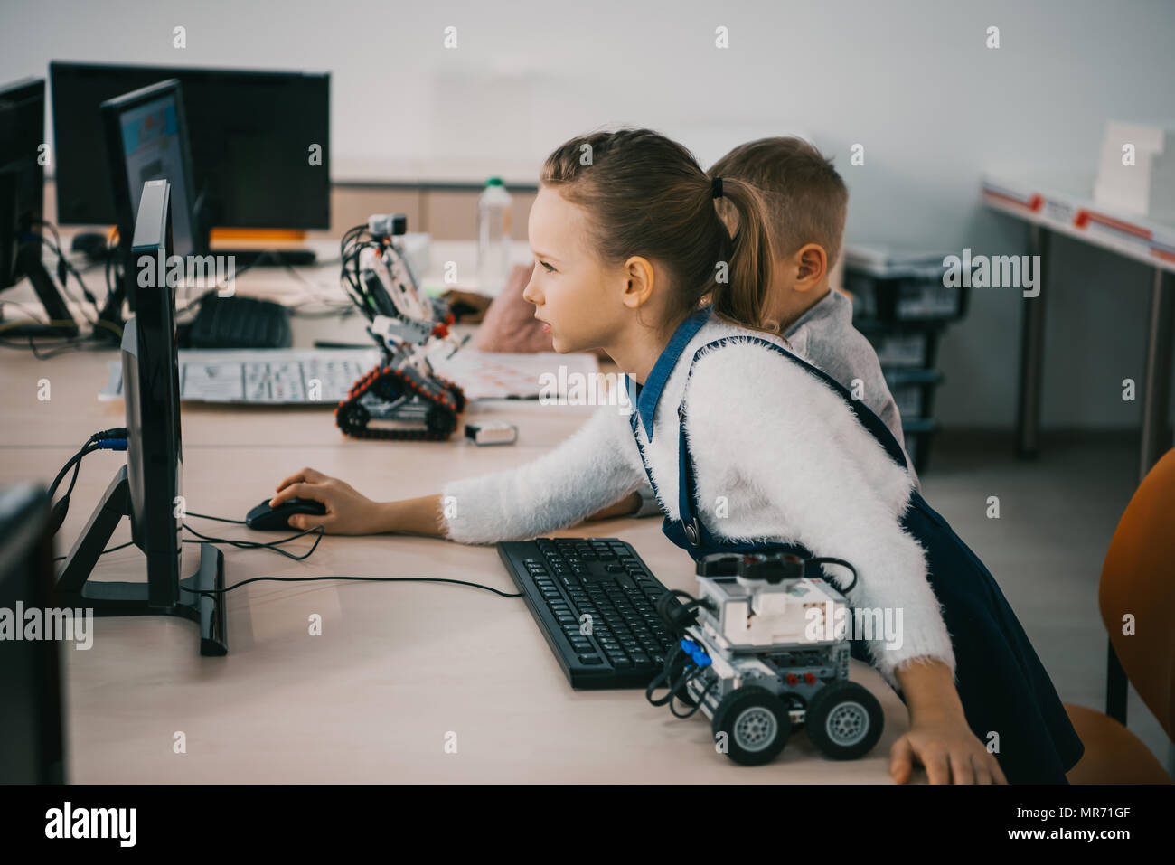 concentrated teen child programming robot at class, stem education ...