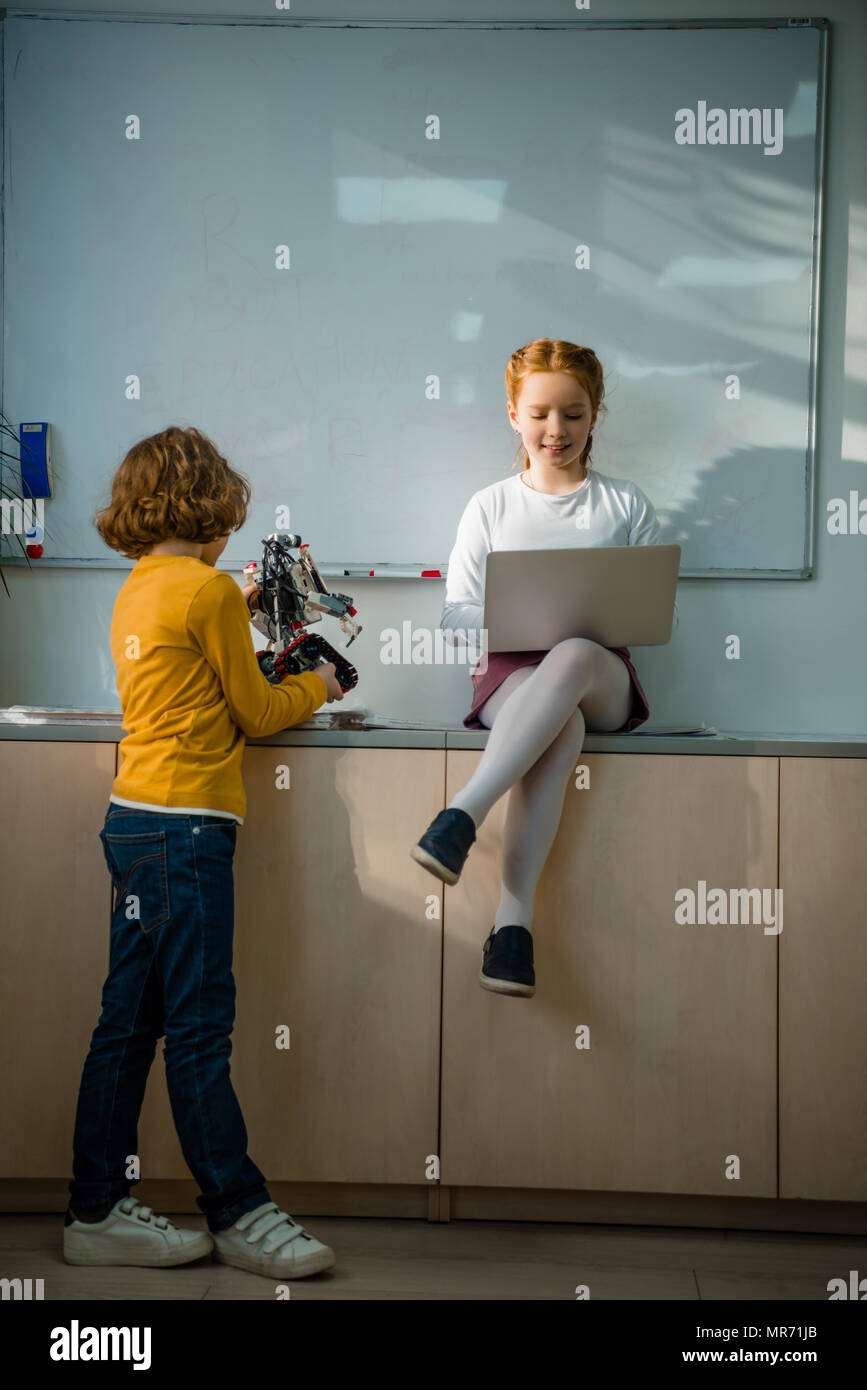 adorable little schoolkids working together on machinery class Stock ...