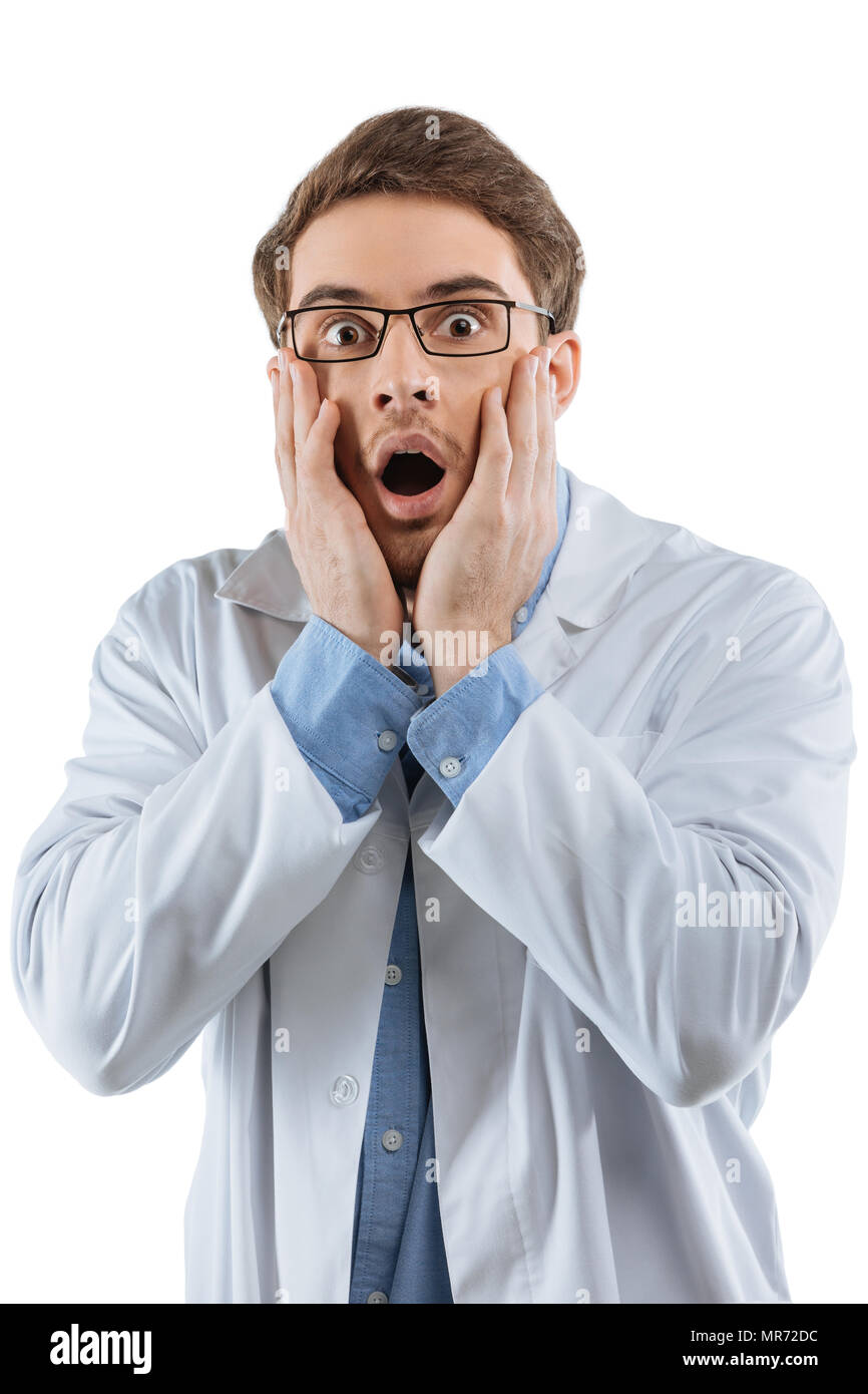 young shocked male chemist in white coat, isolated on white Stock Photo ...