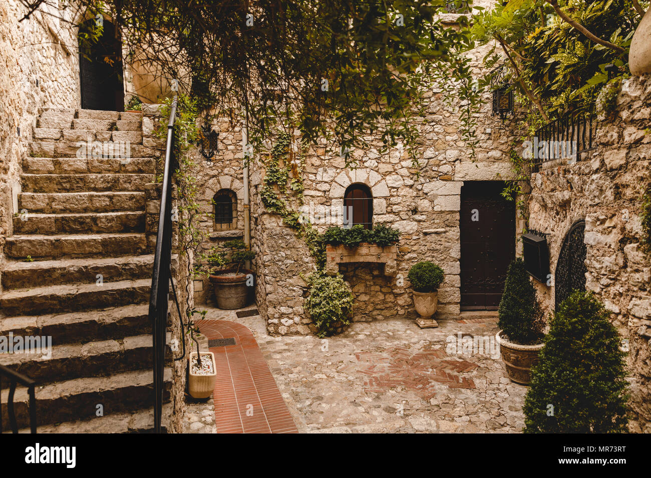 stairs at small atrium of ancient stone building, Eze, France Stock ...