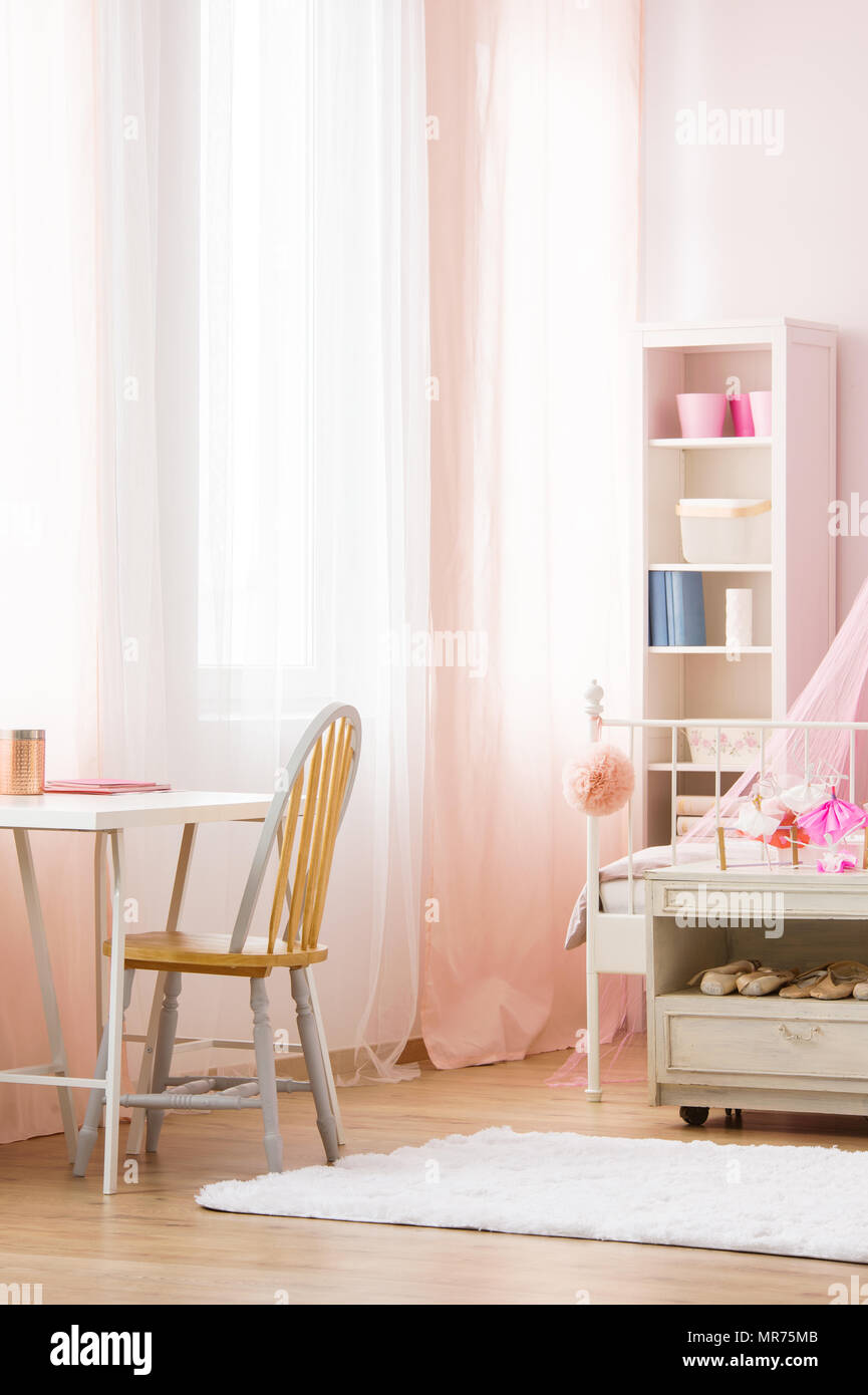 Pink room with window, bed, bookshelf, chair and desk Stock Photo - Alamy
