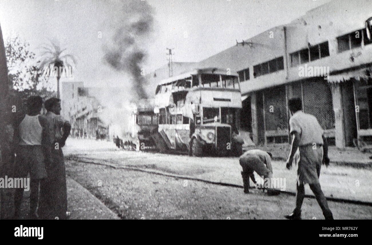 Buses in Tel Aviv, Israel, are damaged during an air raid in the 1948 ...