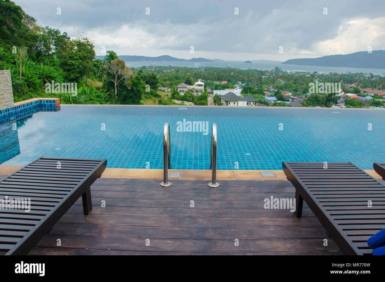 Swimming pool beautiful in tropical resort Stock Photo - Alamy