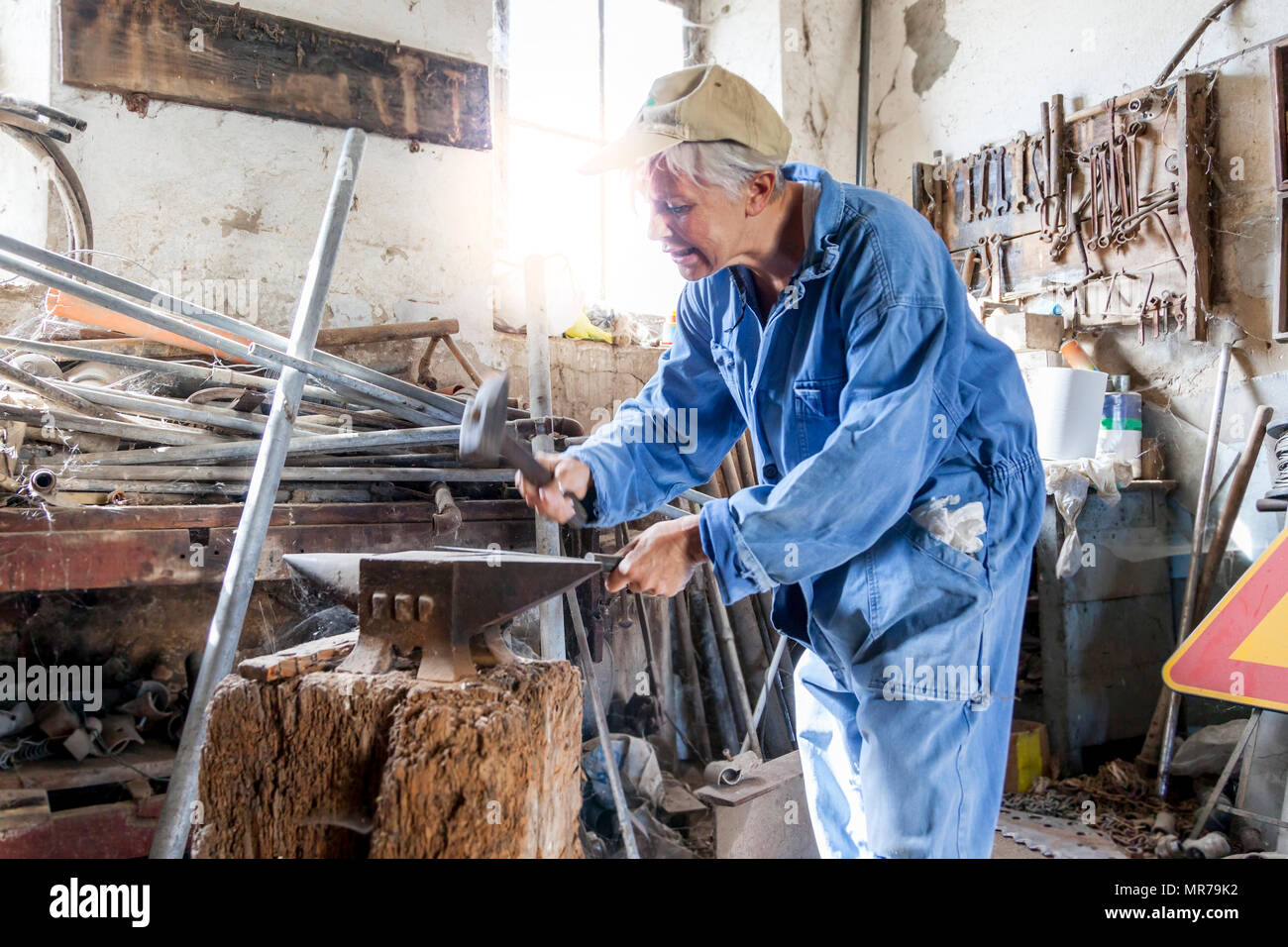 beautiful lady at work in his old workshop Stock Photo - Alamy