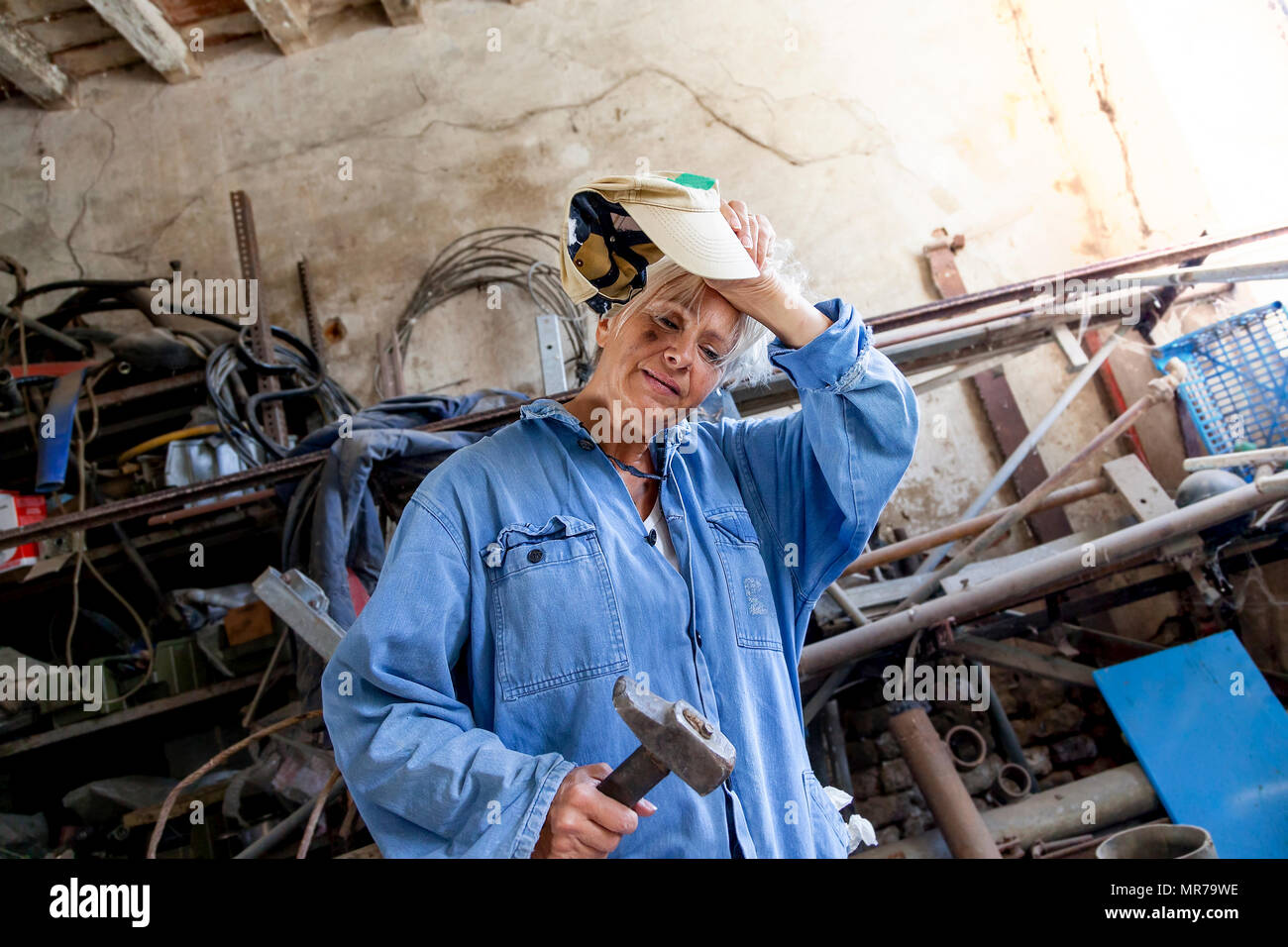 beautiful lady at work in his old workshop Stock Photo - Alamy