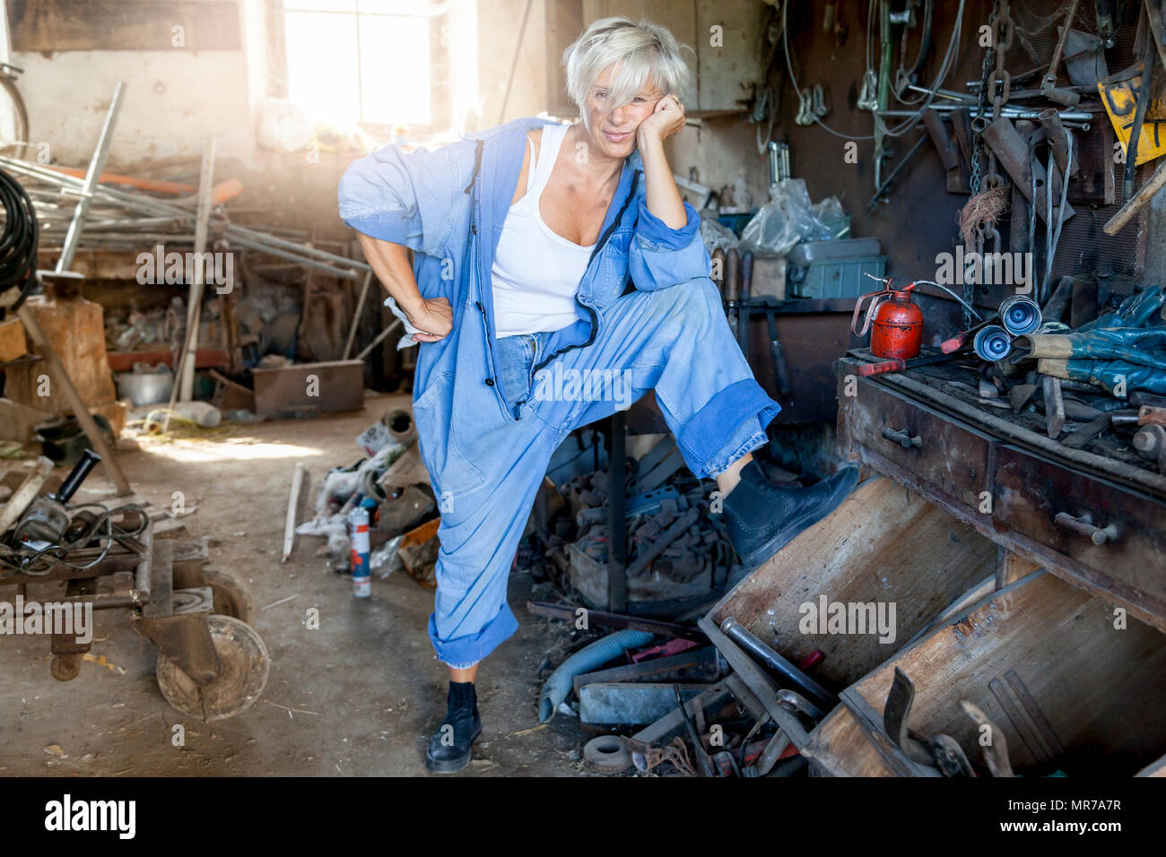beautiful lady at work in his old workshop Stock Photo - Alamy