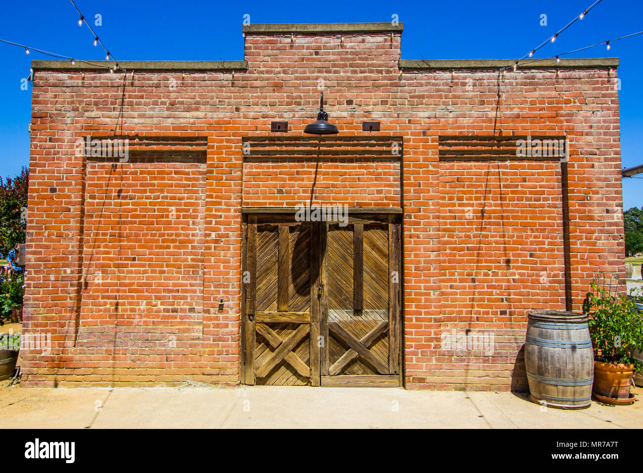 Vintage Wooden Wine Barrel In Front Of Used Brick Building Stock Photo ...