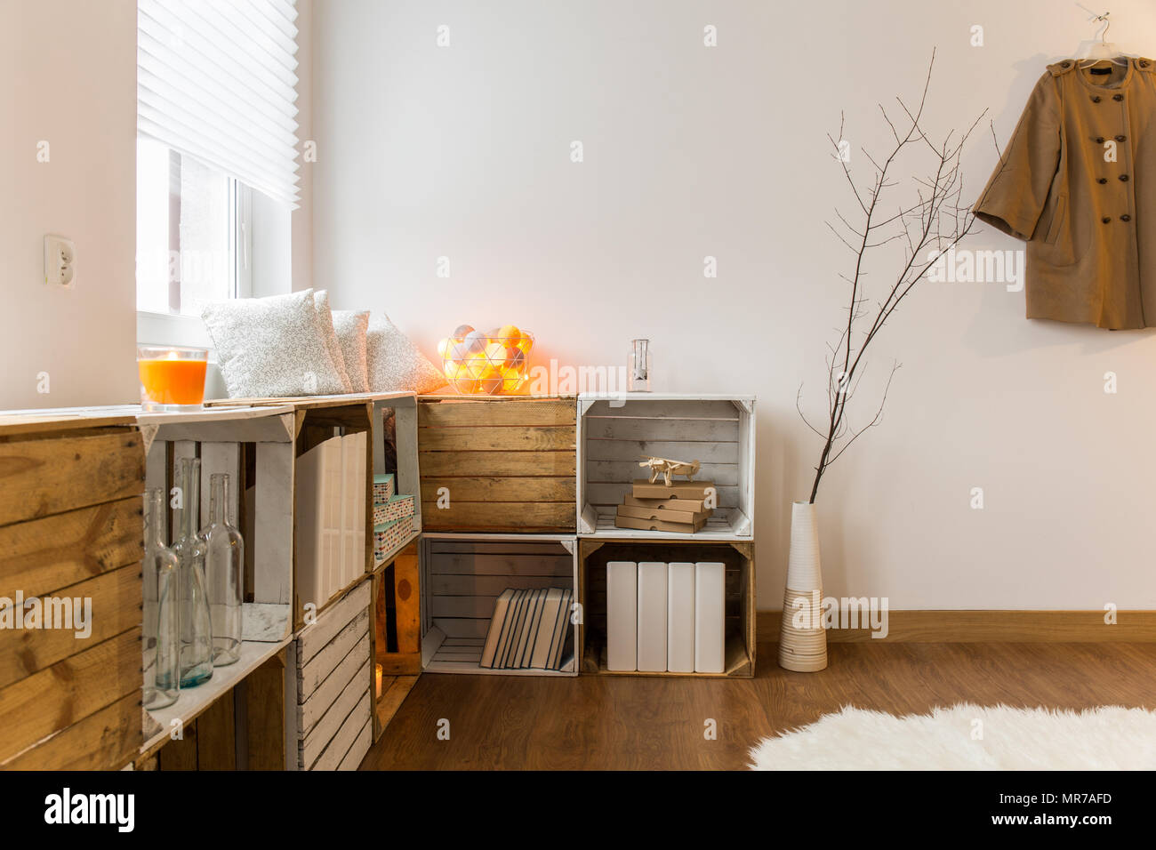 Light room with bookcase made from wooden boxes Interior with flooring ...