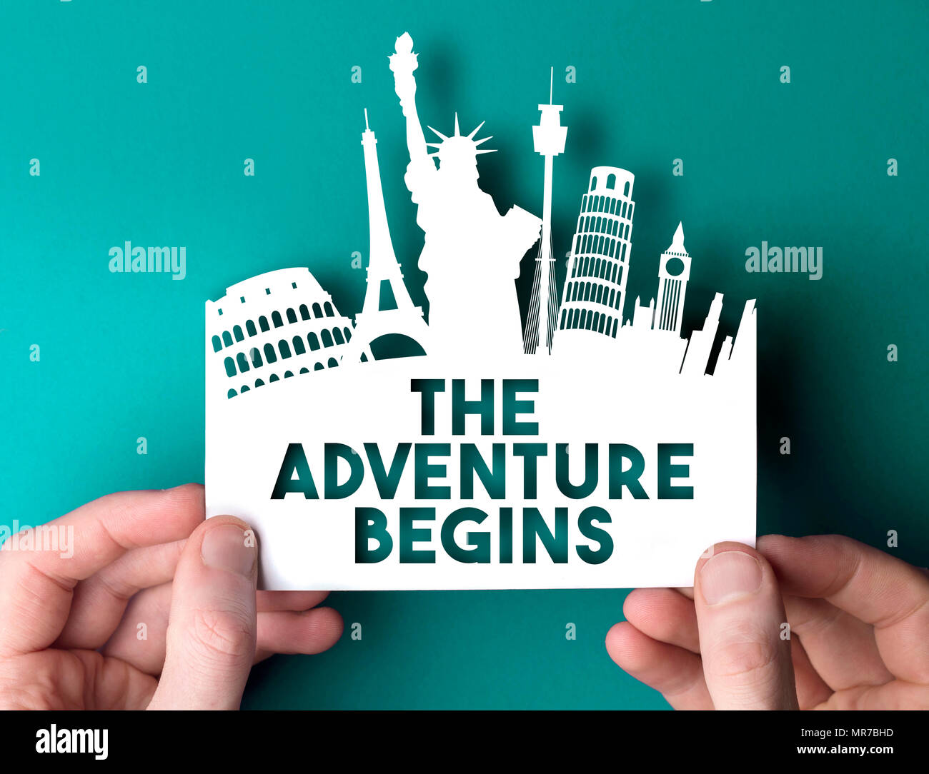 The adventure begins paper cut out shape with famous city travel ...