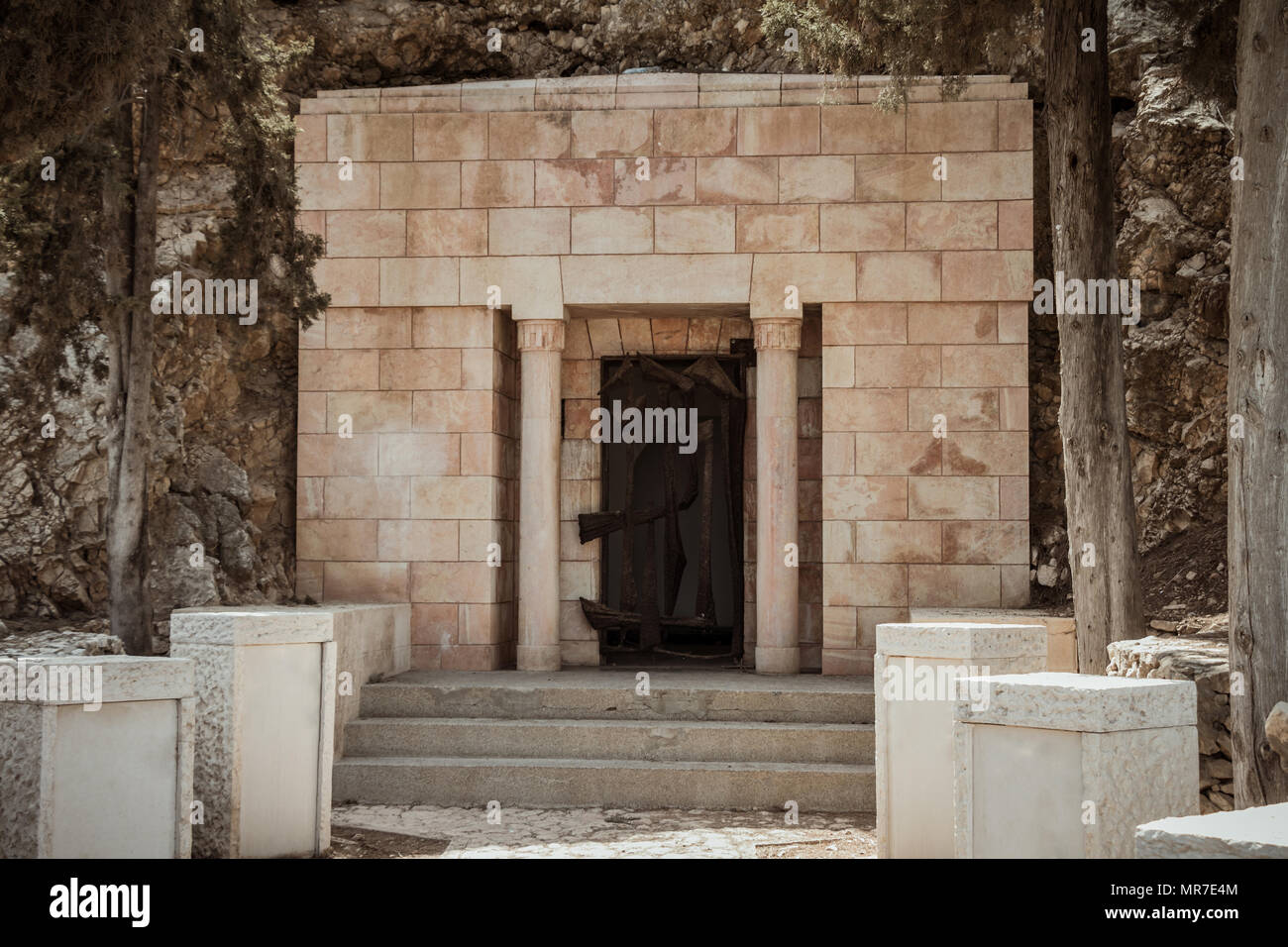 Entrance to an old small private bricks stone tomb carved into the ...