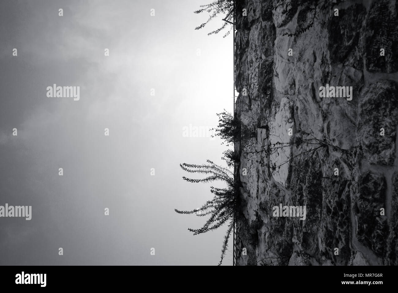Low angle view of part of ancient stone wall Stock Photo - Alamy