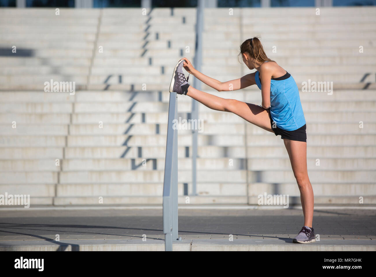 Woman Athlete preparing to run Stock Photo - Alamy