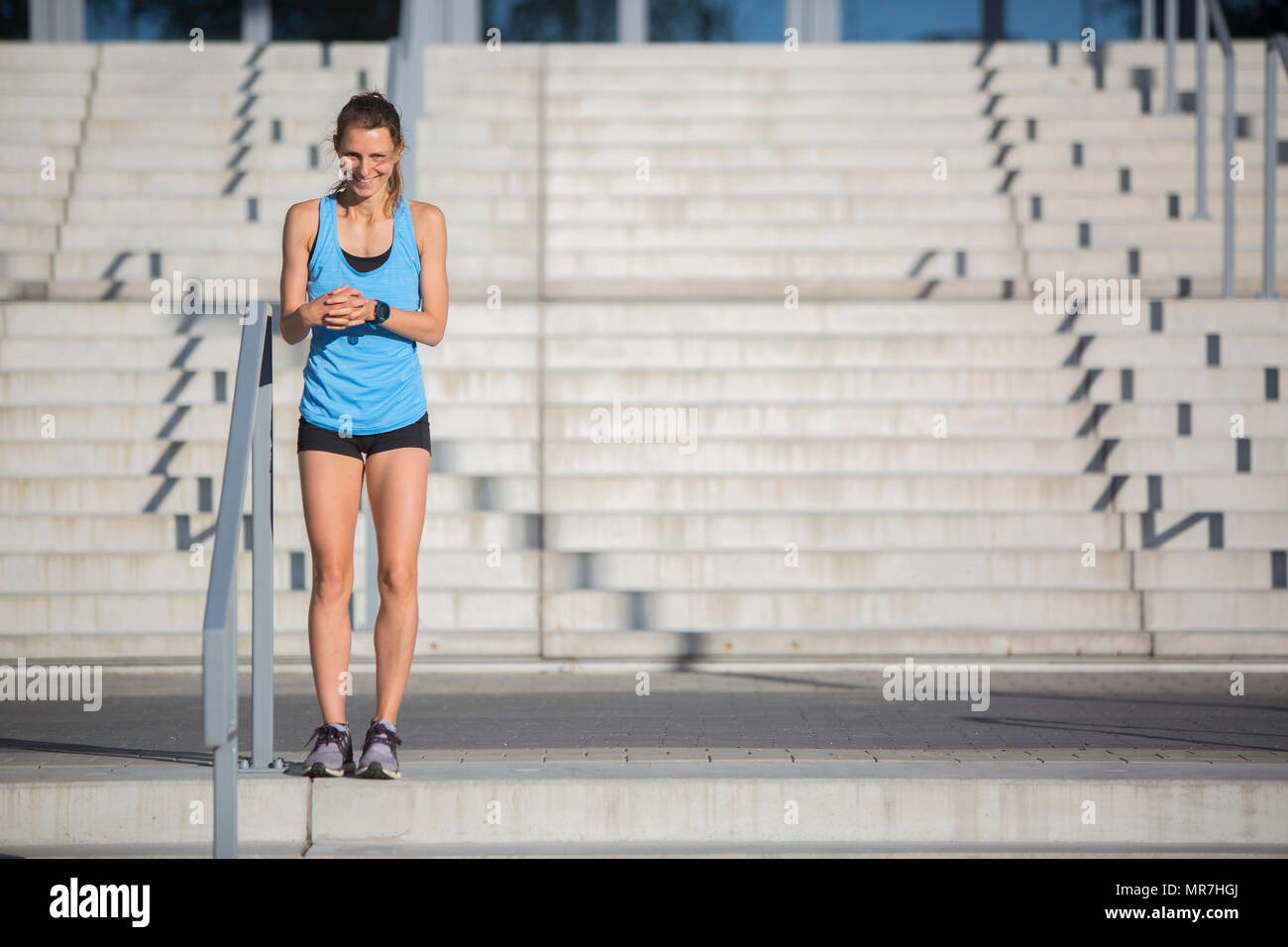 Cute Athlete woman warming up Stock Photo - Alamy