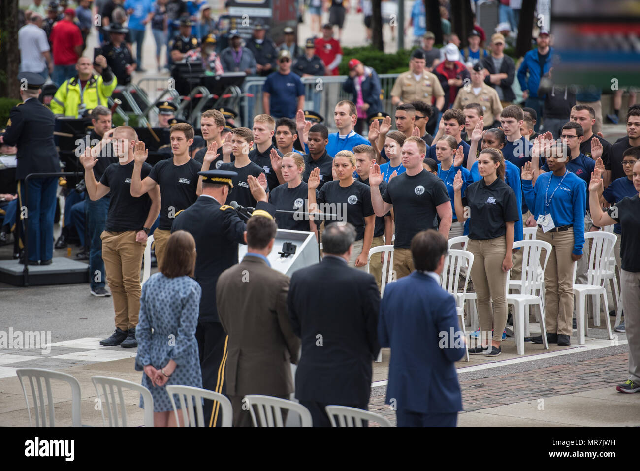 Maj. Gen. Courtney P. Carr renders the oath of enlistment to new ...