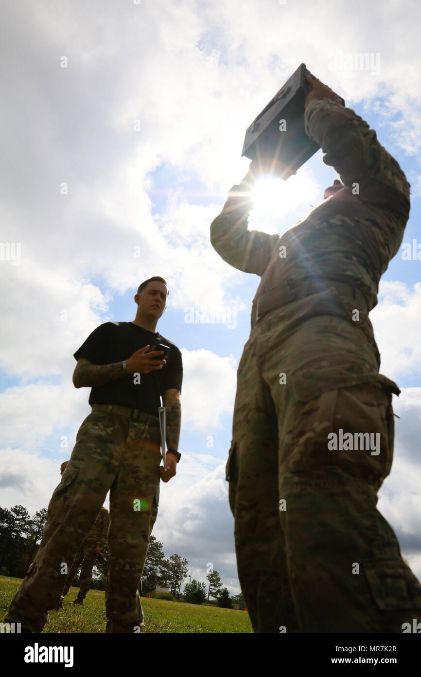 Staff Sgt. Sean Wesley (left), a Paratrooper assigned to Alpha Company ...
