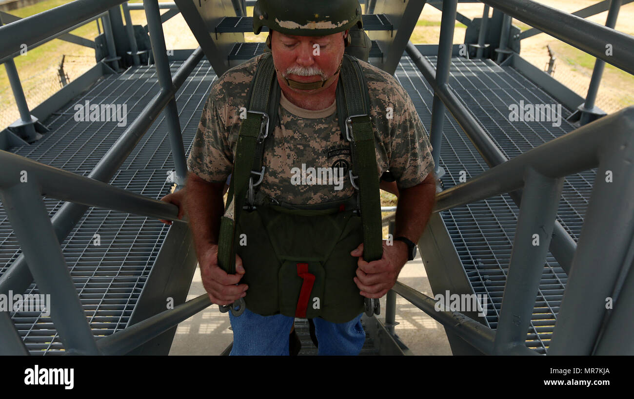 A retired Paratrooper climbs the stairs of the 34-foot tower at the U.S ...