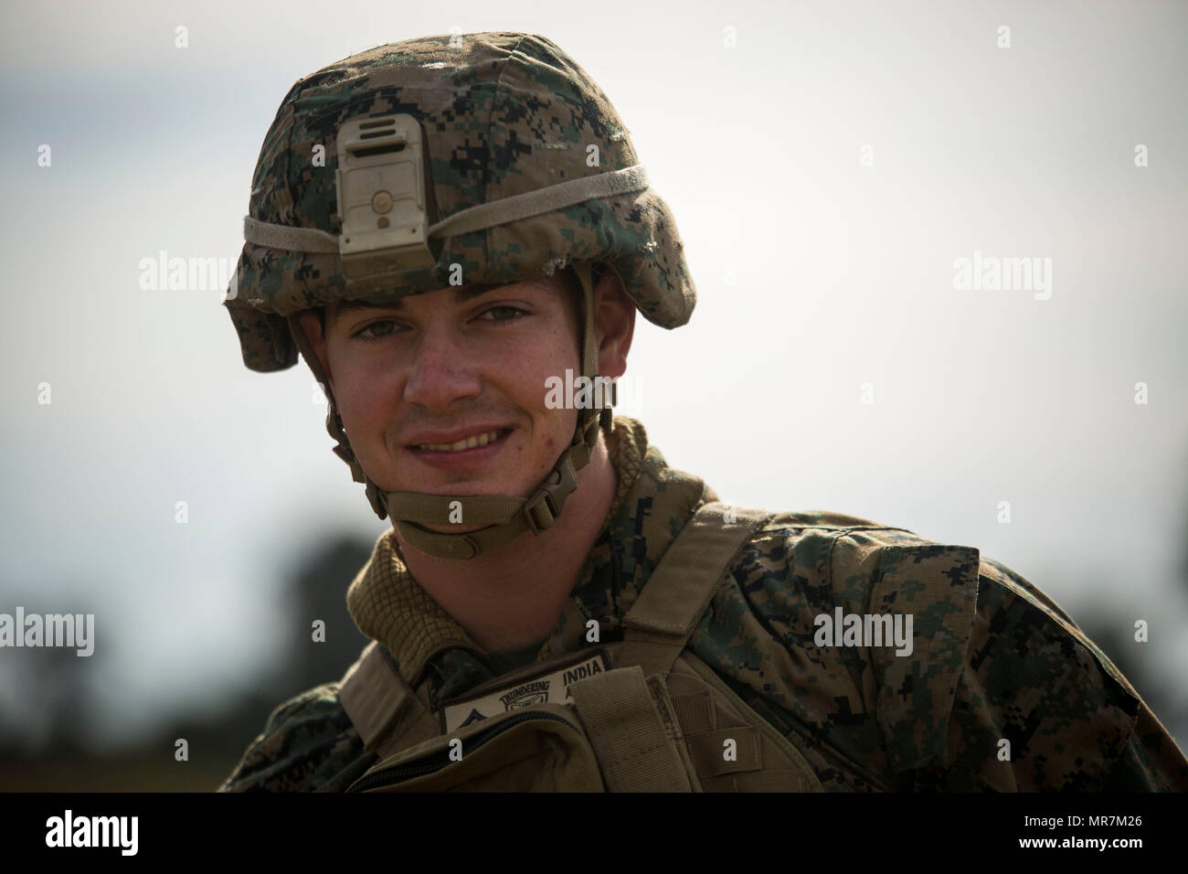 Lance Cpl. John Rudolph receives a score from a shooting match, May 18 ...