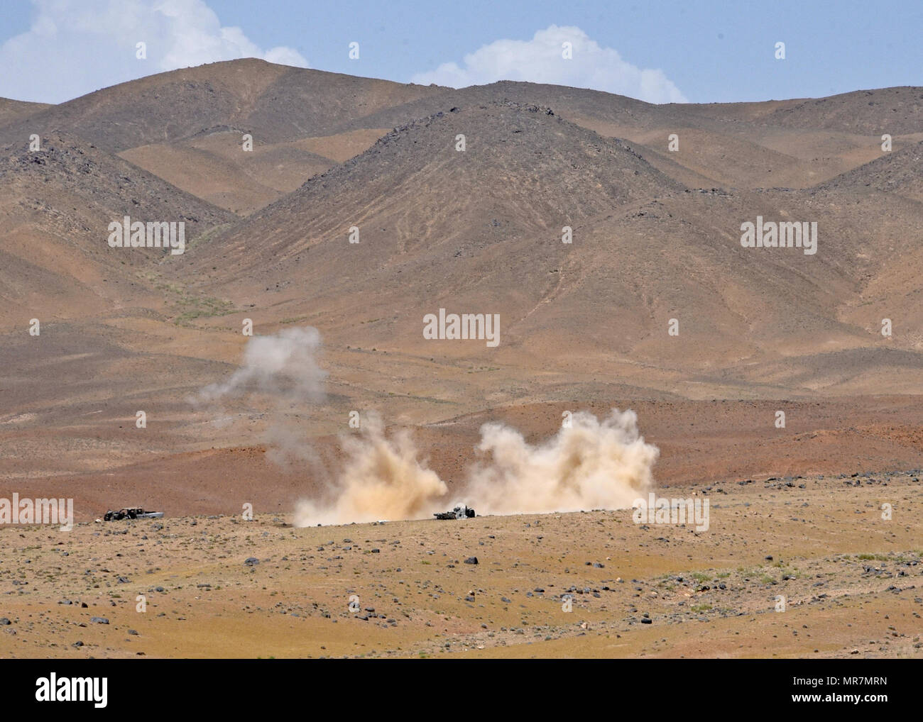 An Afghan Air Force A-29 Super Tucano drops training munitions on a target during live-fire ...