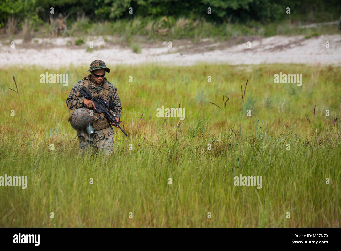 A Marine readies himself for extraction during a helicopter extraction ...