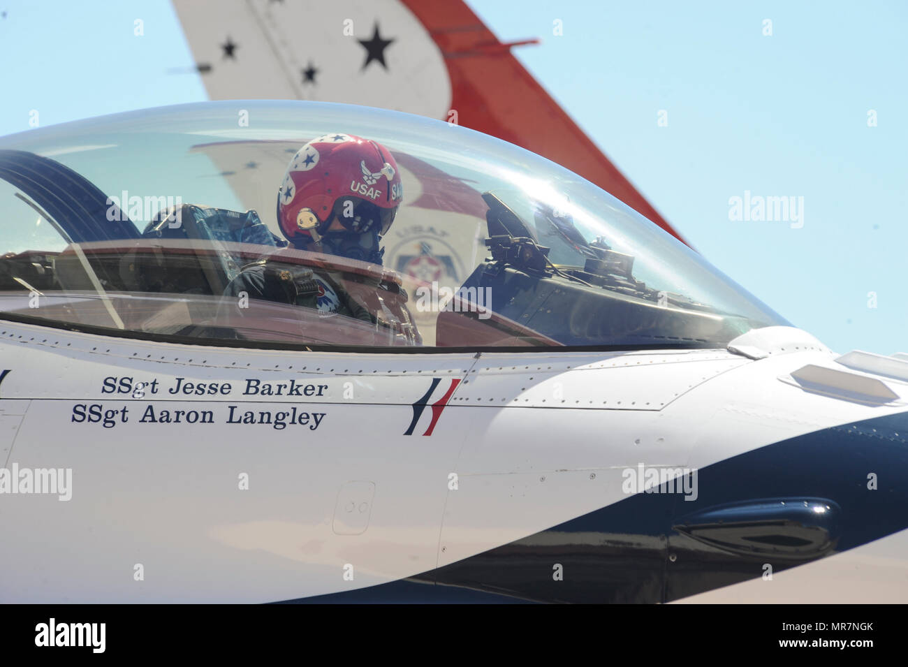 Thunderbird #1, Lt. Col. Jason Heard, looks down at his F-16s cockpit ...