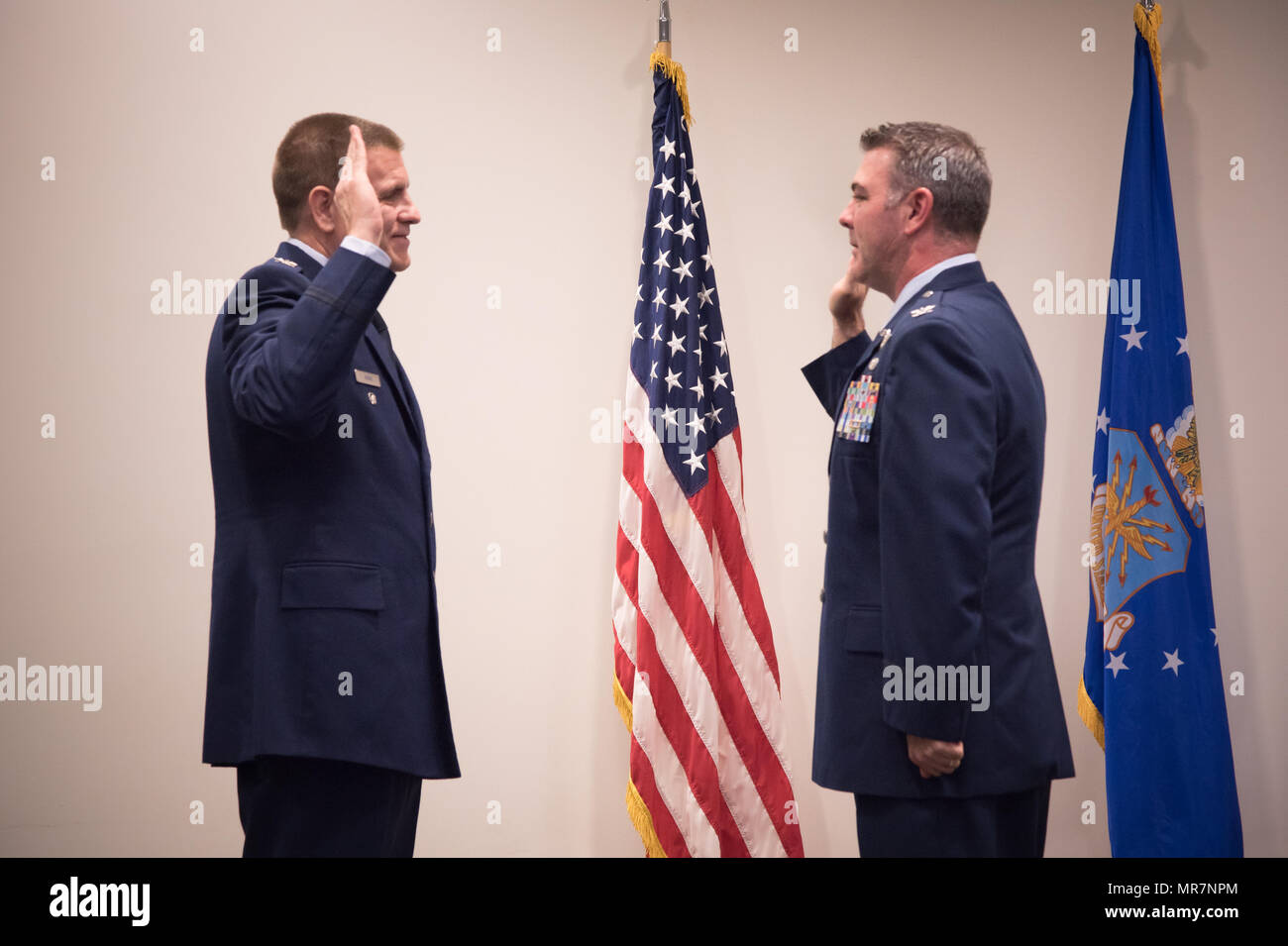 Retired Col. Howard Ward Jr. recites the oath of office to Col. Brian ...