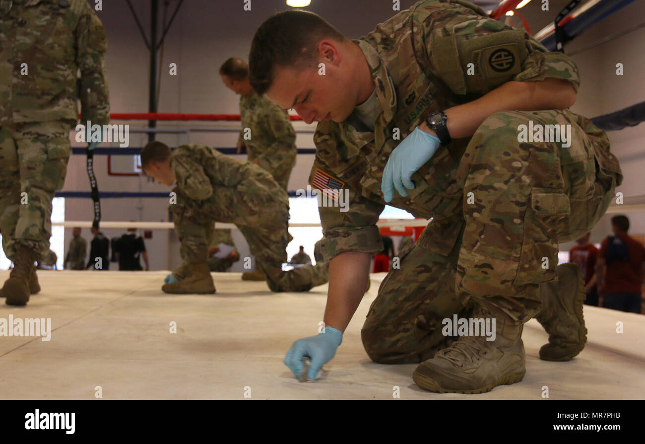 Medical staff clean the boxing arena during the intermission of the All ...