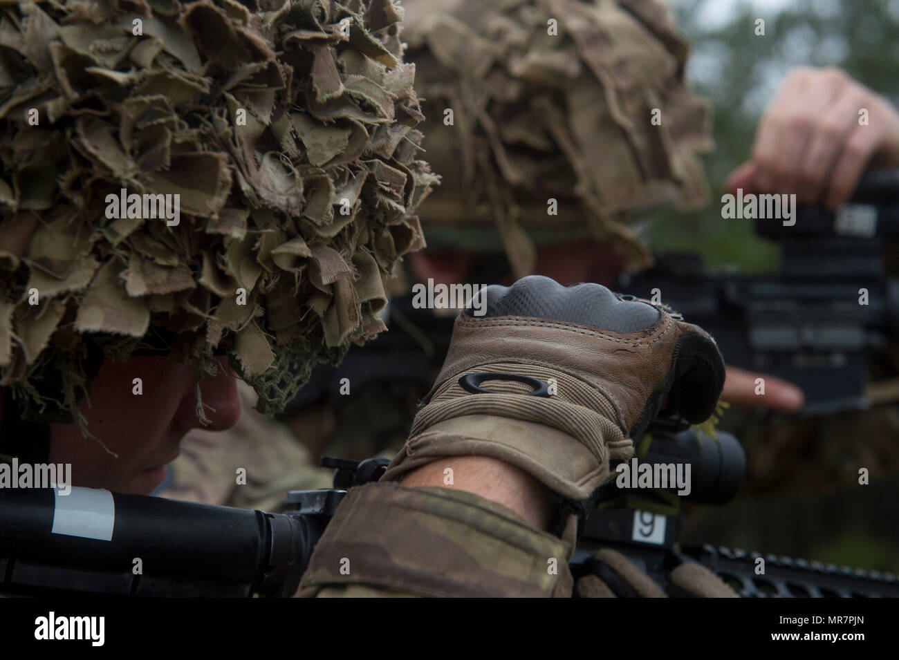 British soldiers assigned to the 3rd (UK) Division adjust M4 carbine ...