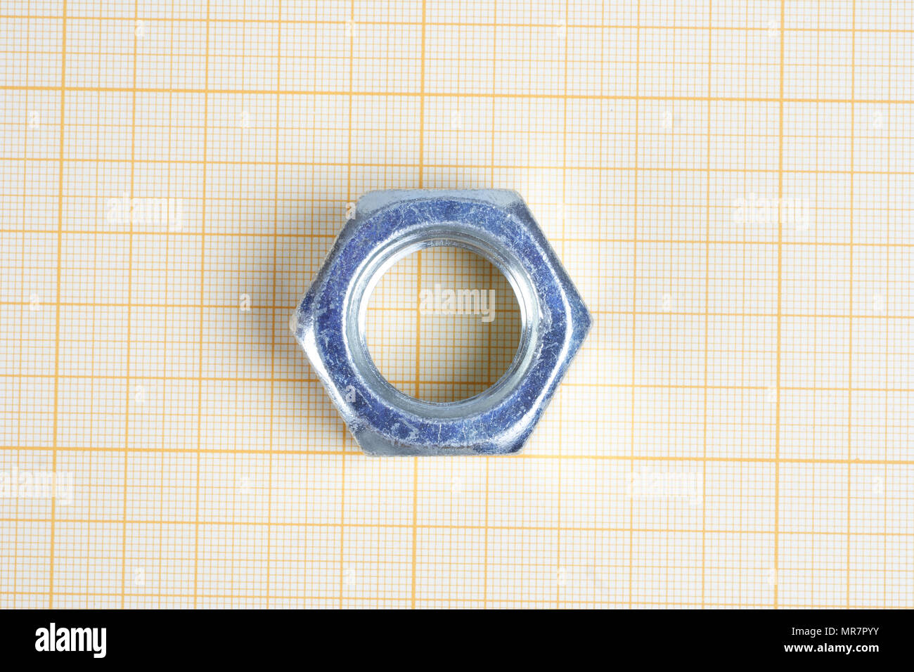 Screw, Nuts and caliper on graph paper background Stock Photo - Alamy