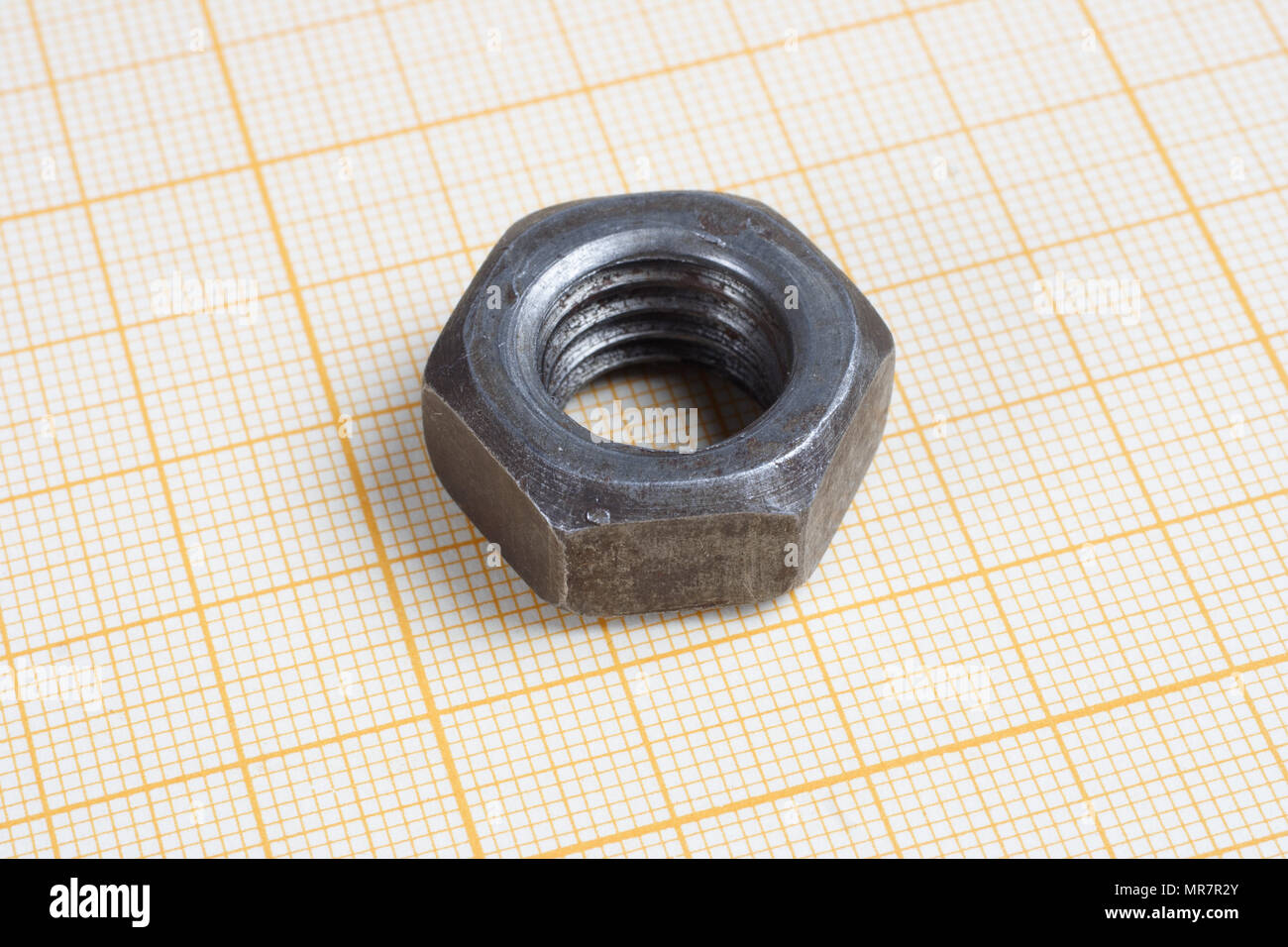 Screw, Nuts and caliper on graph paper background Stock Photo - Alamy