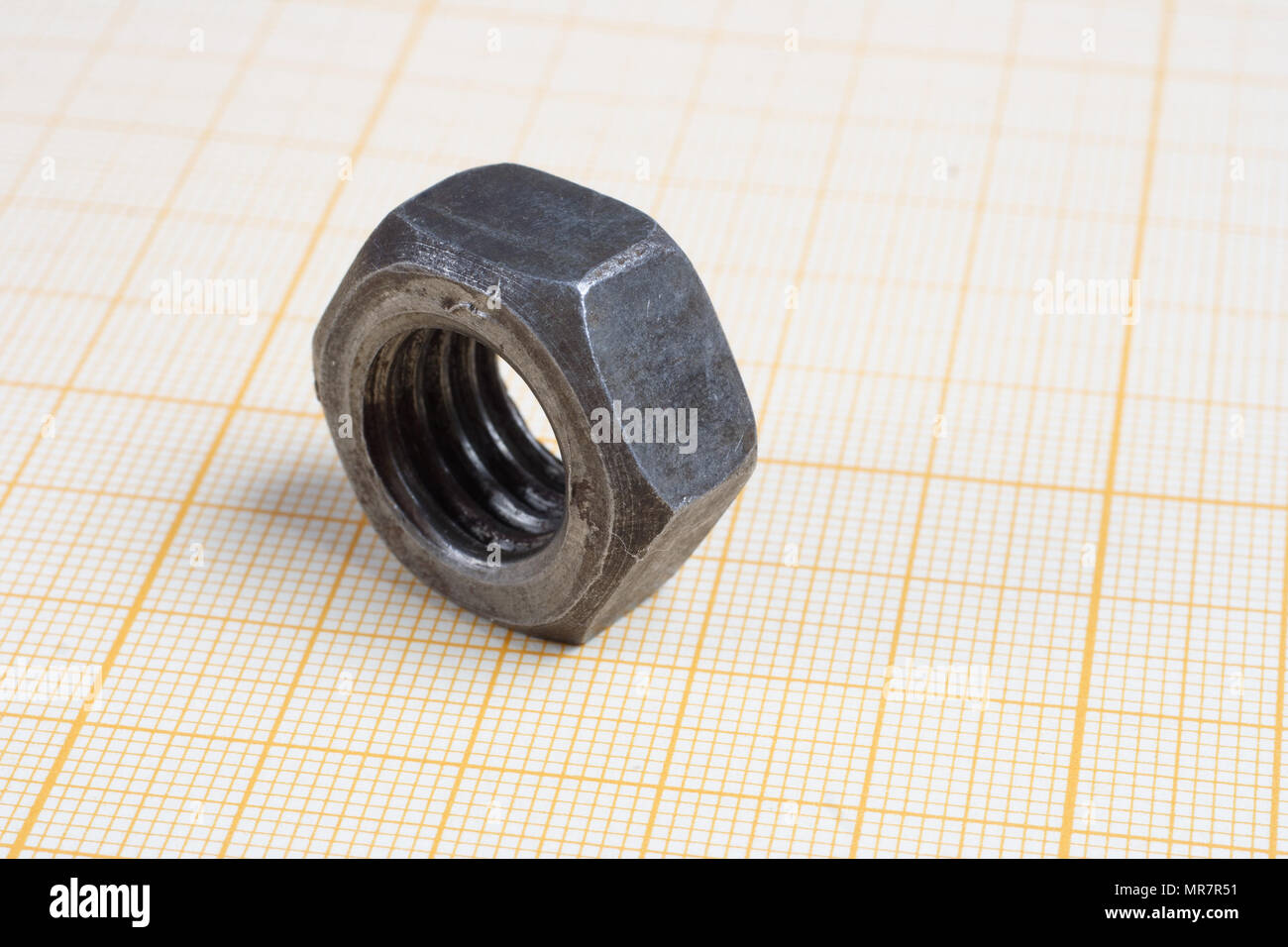 Screw, Nuts and caliper on graph paper background Stock Photo - Alamy