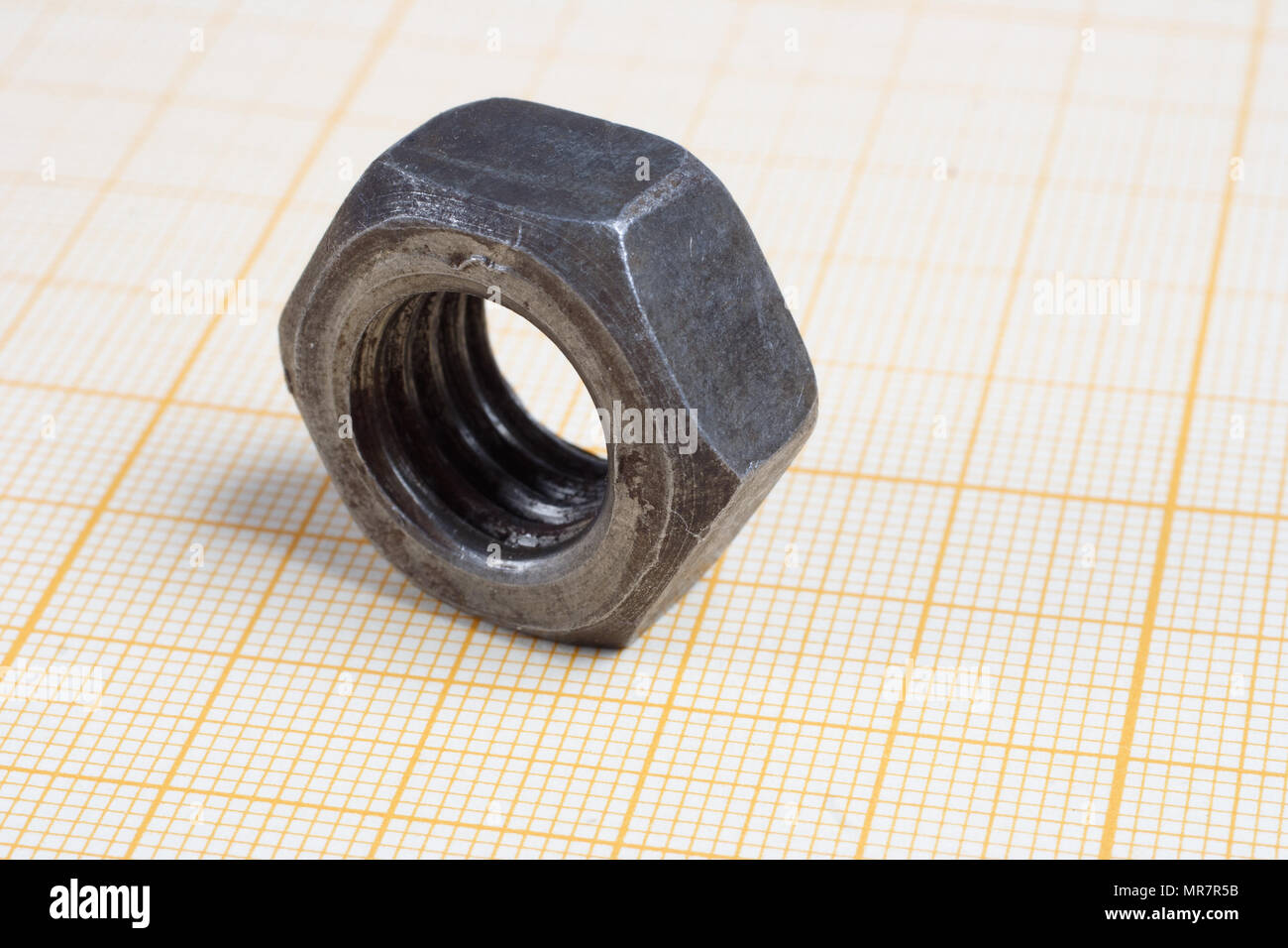 Screw, Nuts and caliper on graph paper background Stock Photo - Alamy
