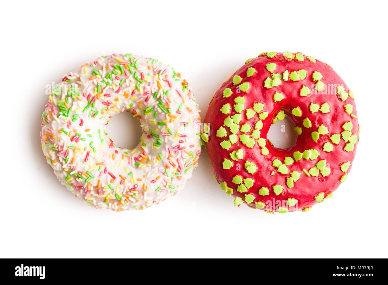 Sweet sprinkled donuts isolated on white background Stock Photo - Alamy