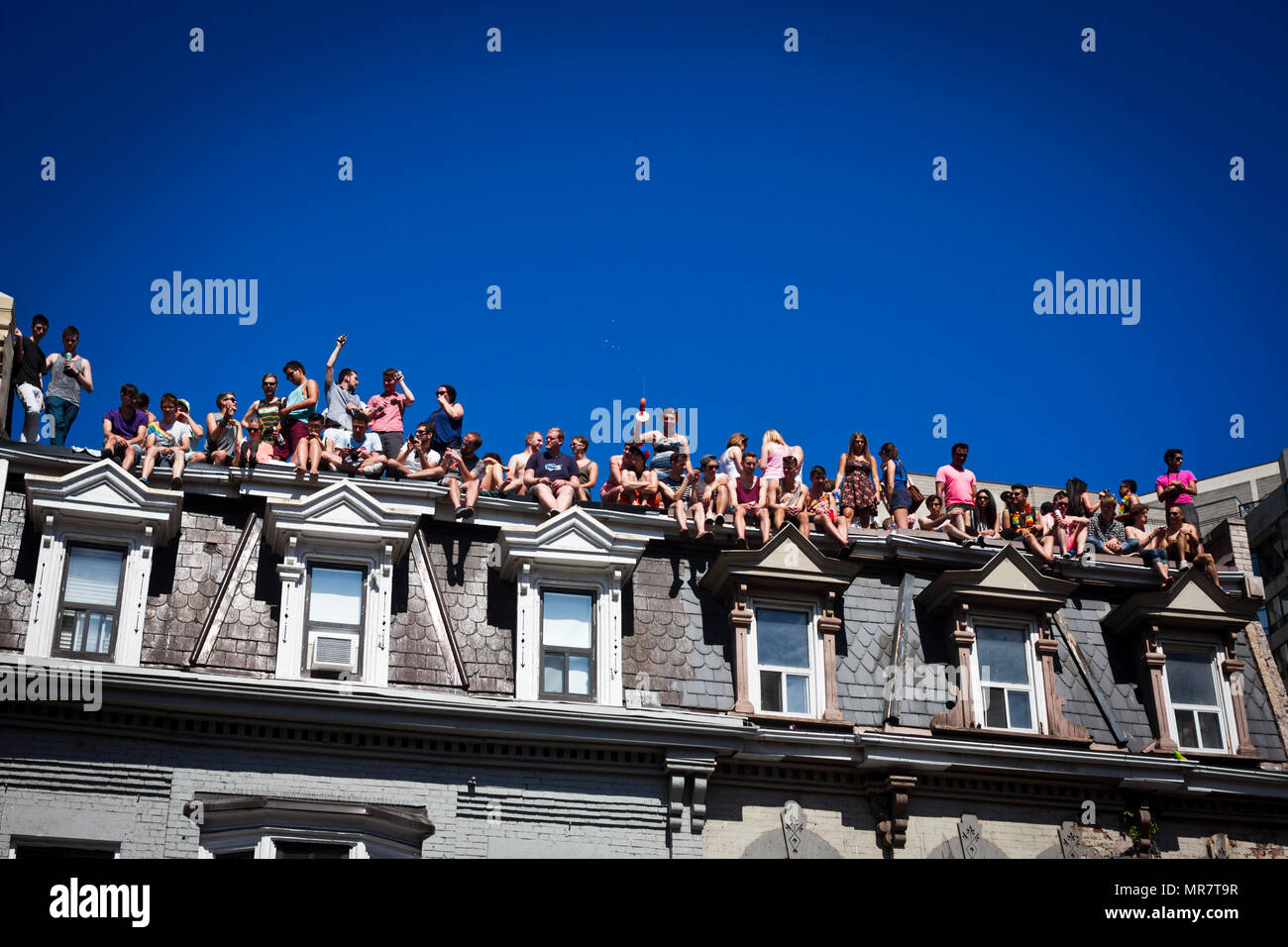 The crowd watches the Gay Pride parade in Toronto, Canada Stock Photo ...