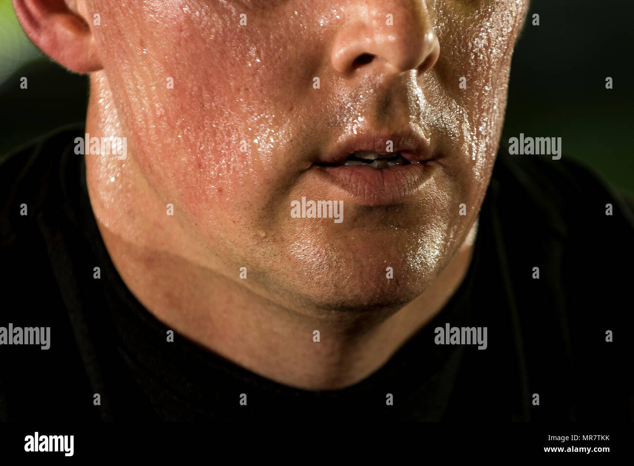 Sweat drips down the face of a U.S. Army Reserve Soldier from the 200th ...
