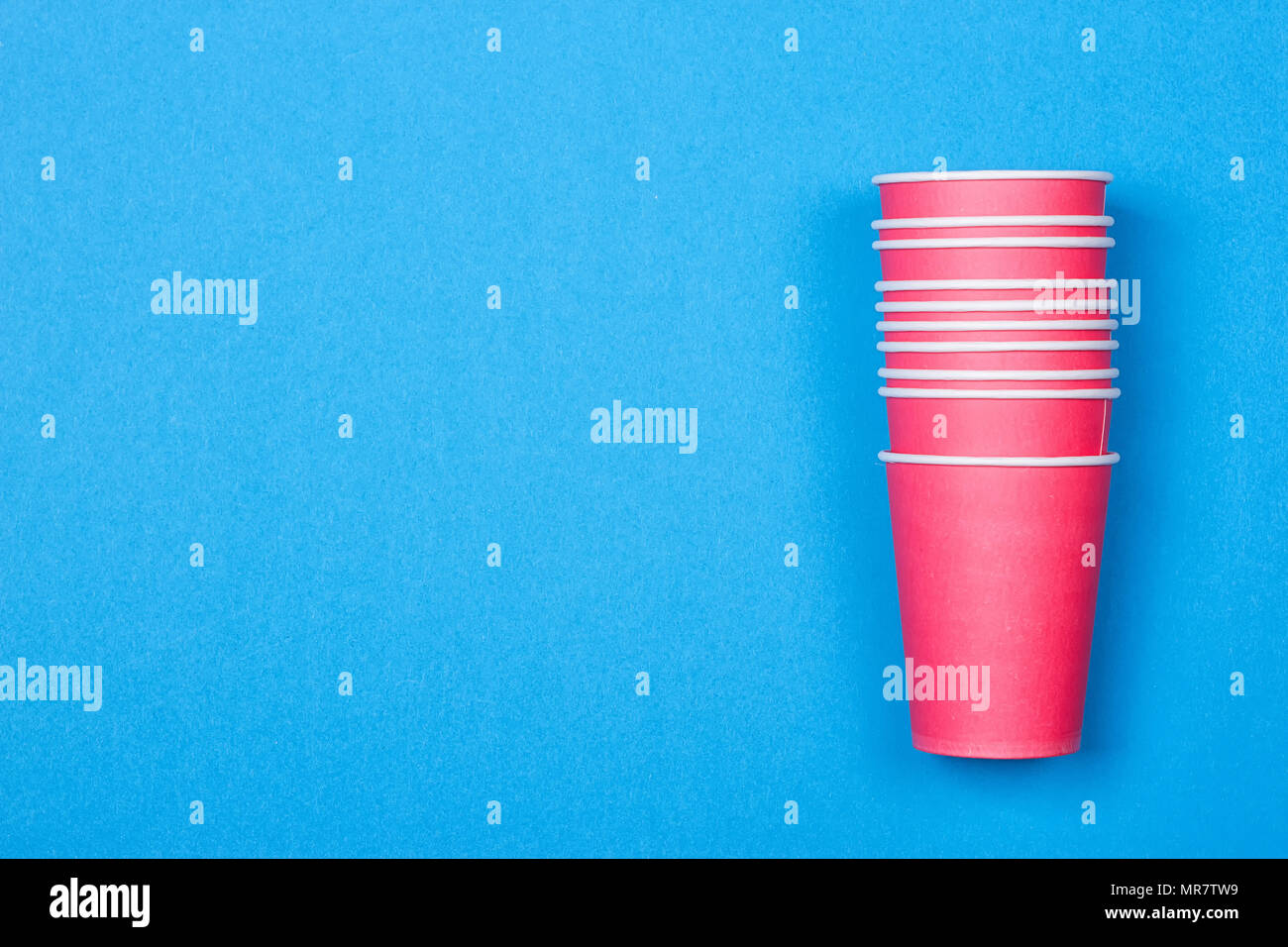 recycling colorful paper glass on the blue background Stock Photo - Alamy