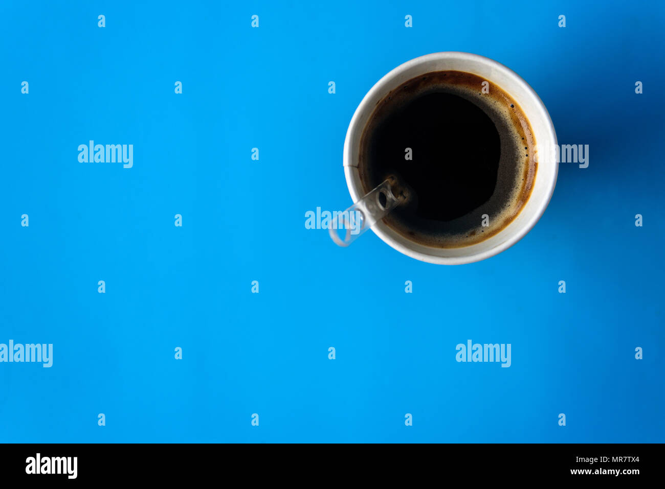 Instant coffee in paper cup on light blue pastel background Stock Photo ...