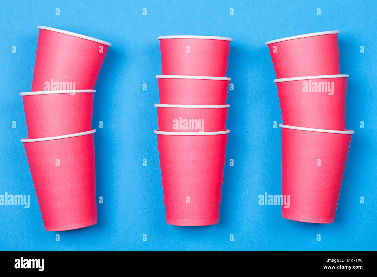 recycling colorful paper glass on the blue background Stock Photo - Alamy