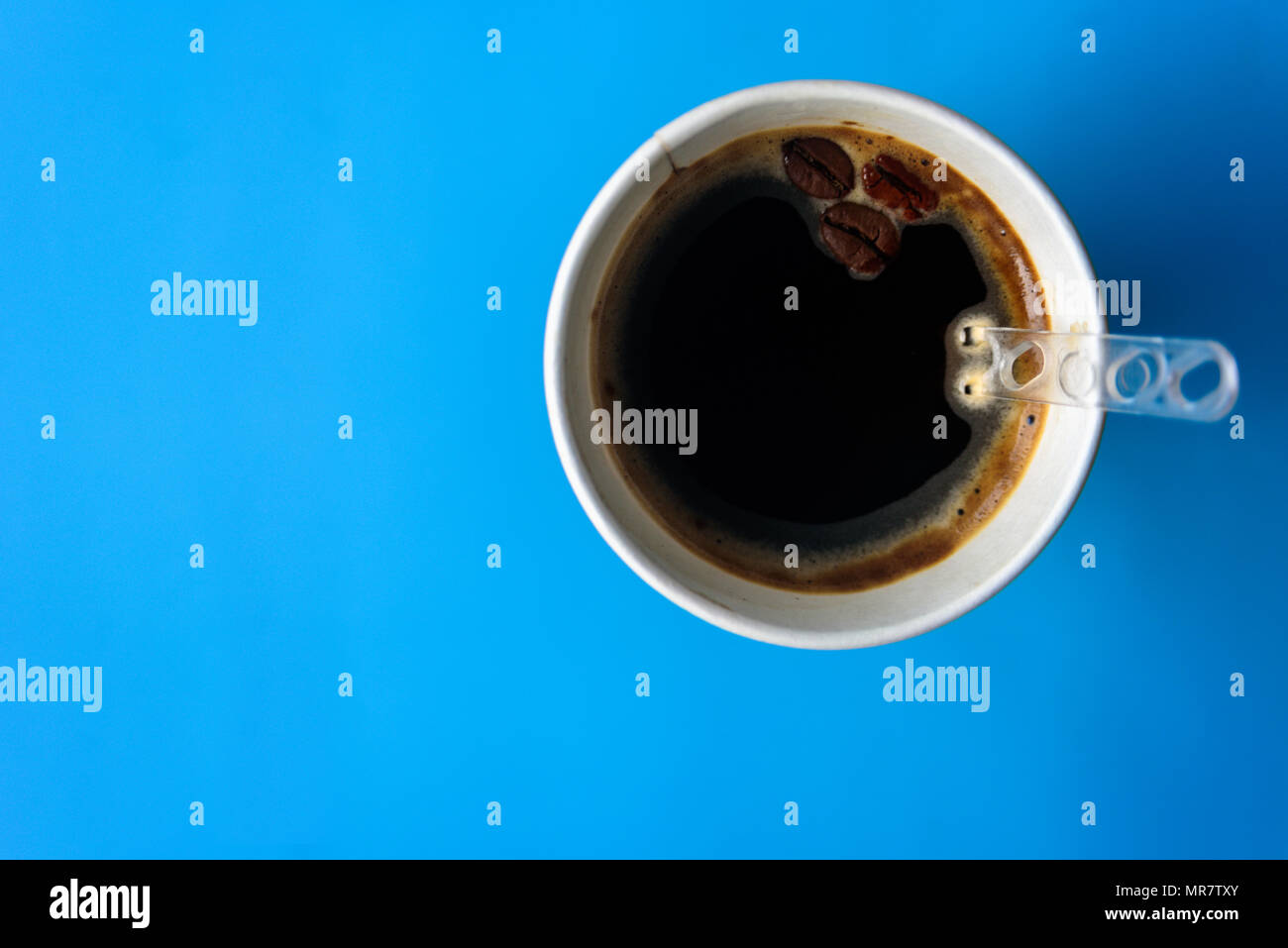 Instant coffee in paper cup on light blue pastel background Stock Photo ...